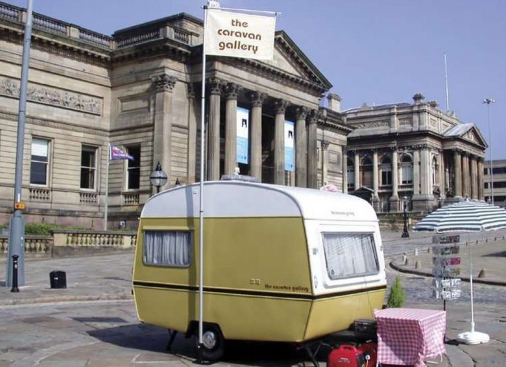 Couple turn caravan into touring art gallery