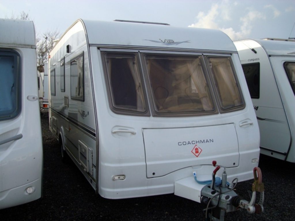 Couple's Coachman VIP caravan parked at their vow renewal